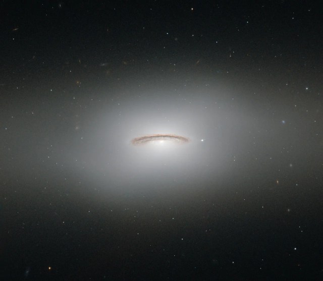 Hubble Views the Whirling Disk of NGC 4526 - NASA Science