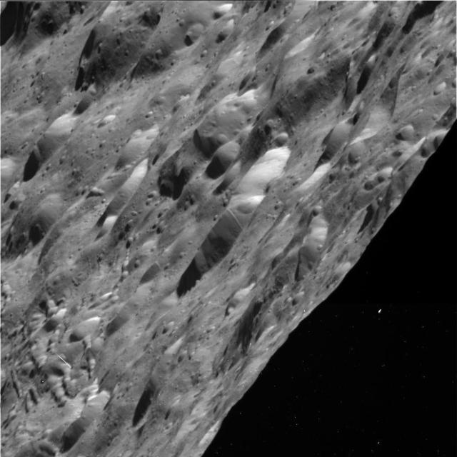 Craggy Craters on Rhea - NASA Science