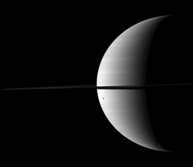 Dione's Distorted Shadow - NASA Science