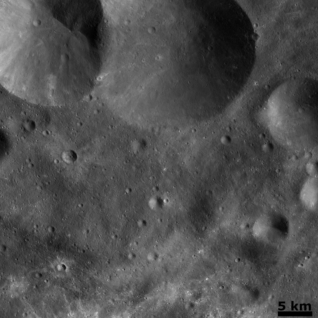 Vesta's Cratered Landscape: Double Crater and Craters with Bright Ejecta - NASA Science