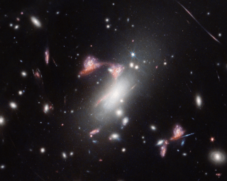 NASA’s Webb Reveals Distorted Galaxy Forming Cosmic Question Mark ...