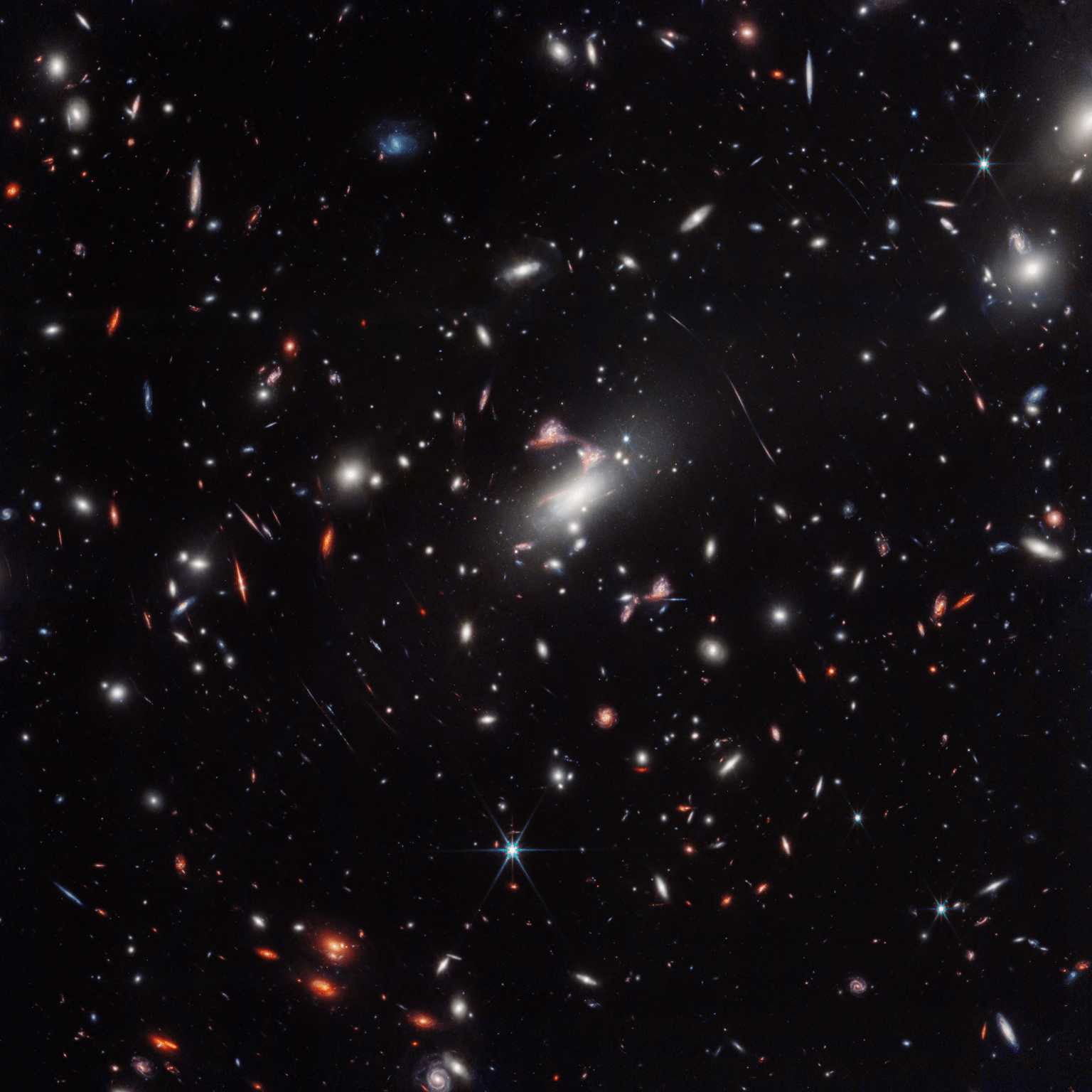 NASA’s Webb Reveals Distorted Galaxy Forming Cosmic Question Mark ...